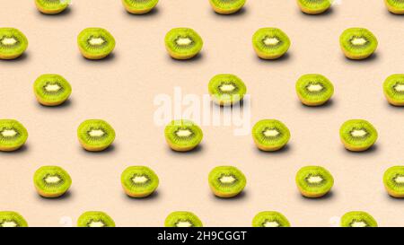 Repeated pattern of many sliced ripe kiwi fruits on light green ...