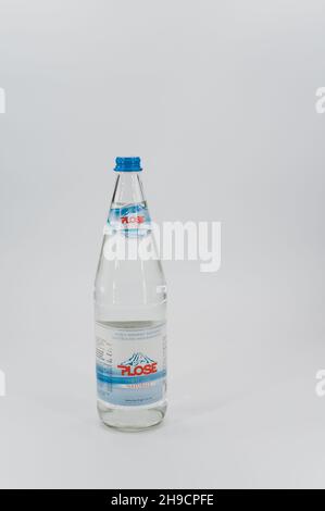INVERIGO, ITALY - Dec 03, 2021: light natural water glass bottle on a ...