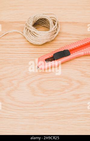 cutter and rough string on a wooden tabletop Stock Photo - Alamy