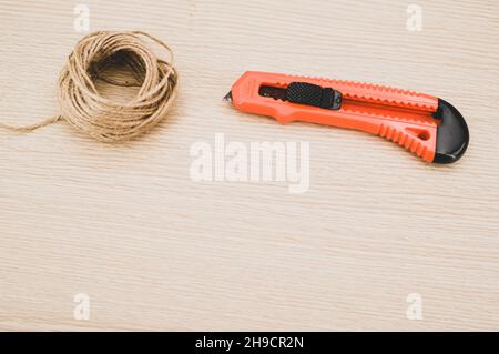 cutter and rough string on a wooden tabletop Stock Photo - Alamy