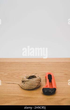 cutter and rough string on a wooden tabletop Stock Photo - Alamy