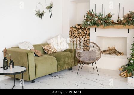 Minimalistic Christmas decoration by the fireplace. Scandinavian rustic ...