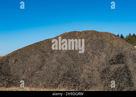 Piles of bulk industrial sand and gravel material Stock Photo - Alamy