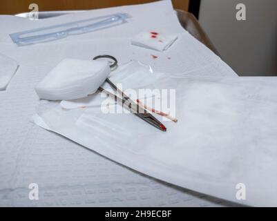 View of a birth control arm implant, freshly removed, sitting on a ...