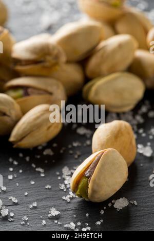 Sea Salt Roasted Pistachios Background. Macro. Selective focus Stock Photo - Alamy