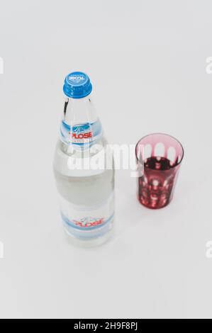 INVERIGO, ITALY - Dec 04, 2021: light natural water glass bottle and ...