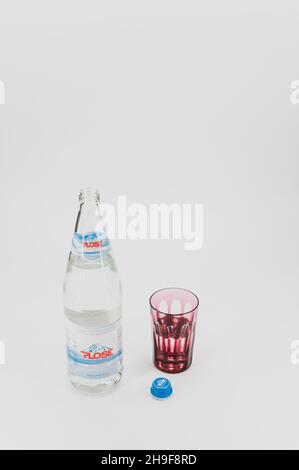 INVERIGO, ITALY - Dec 04, 2021: light natural water glass bottle and ...