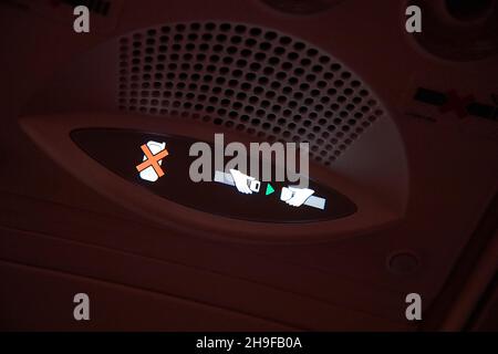 Plane cabin signs Stock Photo - Alamy
