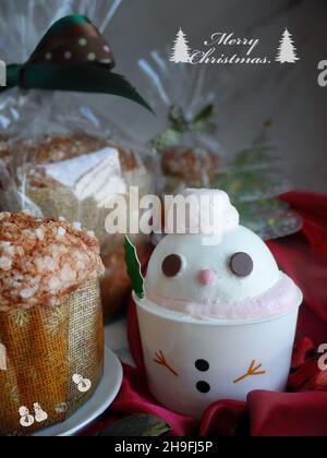 Christmas tree ornament and cupcake with snowman Stock Photo - Alamy