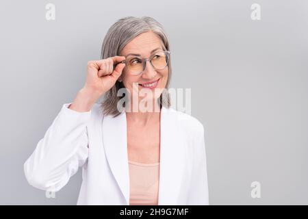 Photo of curious grey hairdo aged lady look empty space wear striped ...
