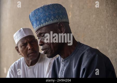 Village leaders (elders) in African village, traditionally dressed in ...