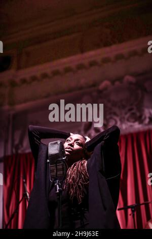 ALA.NI performing with her band on stage at Bush Hall supporting Ibeyi ...