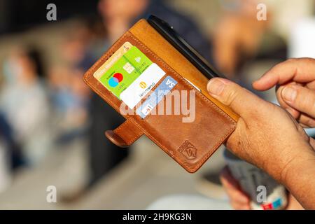 Male hands with wallet and credit cards in office, closeup Stock Photo ...