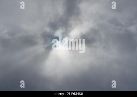 Cloudy sky with snow falling Stock Photo - Alamy