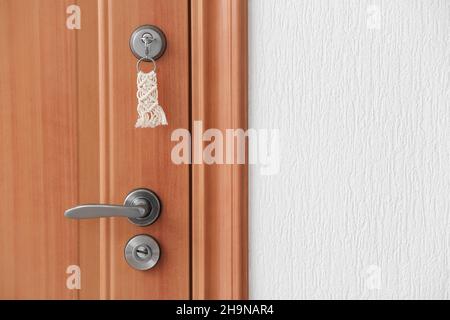 Key inserted in door hole, closeup Stock Photo - Alamy