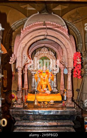 Hindu God Dattatrya in decorative wooden frame Devhara Stock Photo - Alamy