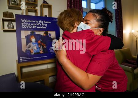Margaret Keenan embraces Nurse May Parsons at University Hospital ...