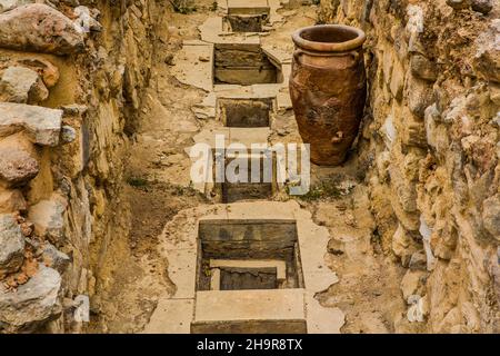 Pithoi, jar-like storage containers for oil, wine, Minoan palace of ...