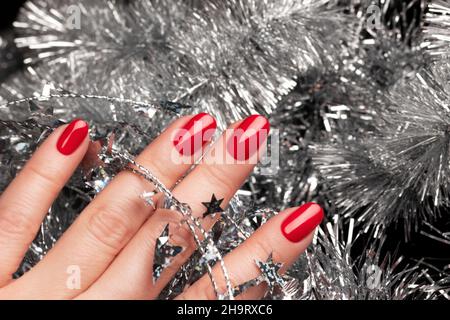 Christmas Gel Nail Design,Woman Hand Manicure painting sparkling foils ...