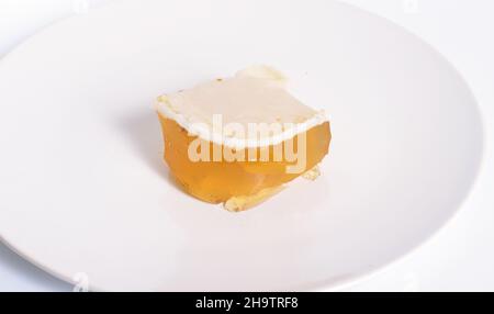 Jelly broth on white plate Stock Photo - Alamy