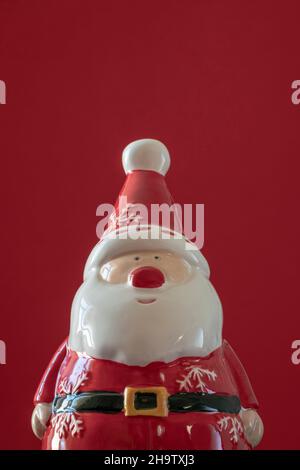 Concept red car with santa isolated on white background. Snow globe is ...