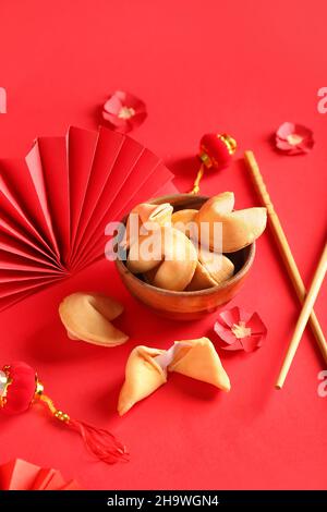 Bowl of fortune cookies and Chinese symbols on yellow background ...