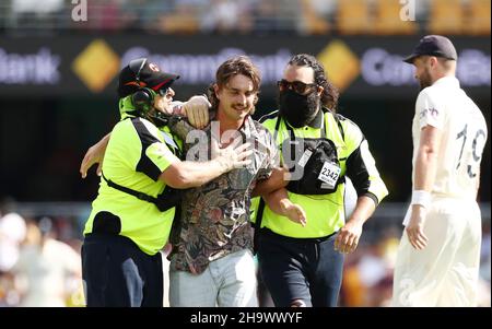 A pitch invader enters the field during day two of the first Ashes test ...