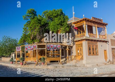 KHIVA, UZBEKISTAN - APRIL 25, 2018: West Gate and Mohammed Amin Khan ...