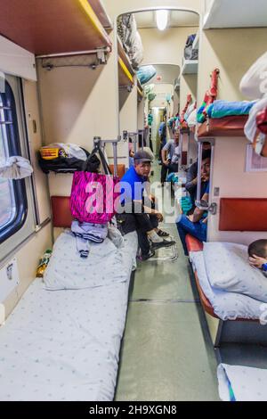 Passengers sleeping in sleeper class of the India railway service ...