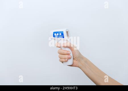 Closeup shot of a thermometer gun, temperature measurement device ...