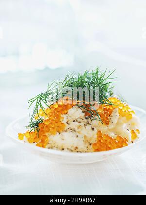 Mashed potato with caviar Stock Photo - Alamy