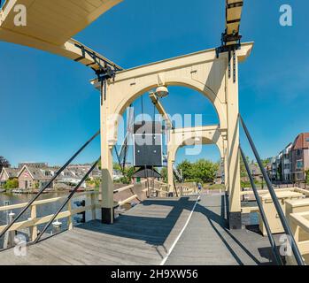 Double drawbridge towards the windmill called De Put Stock Photo - Alamy