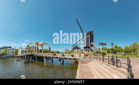 Double drawbridge towards the windmill called De Put Stock Photo - Alamy