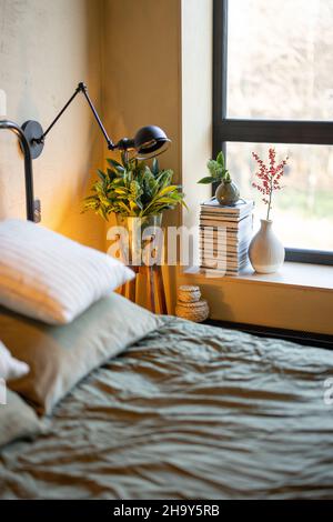 Beautiful Christmas tree, comfortable bed and festive decor in bedroom ...