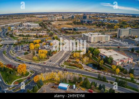 An aerial shot of the modern cityscape of Denver under the blue cloudy ...
