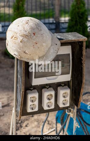 Industrial sockets and plug on distribution board. Construction site ...