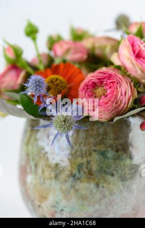 Flowers bouquet in glazed vase on white background Stock Photo - Alamy