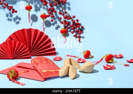 Composition with tasty fortune telling cookies and Chinese symbols on ...