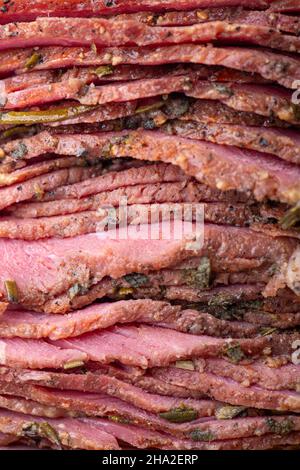 Delicious thinly sliced beef pastrami club sandwich with fresh curly ...
