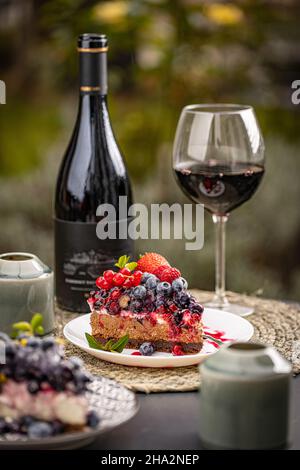 Chocolate pastry with fresh fruit served with a cup of black coffee ...