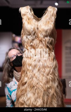 A visitor views 'Blond hair dress' by artist Jenni Dutton, made with ...