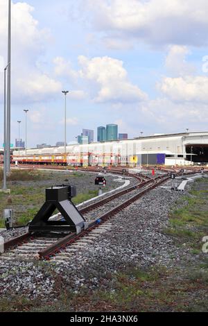 End of the line. A red railway stopper the the end of rusty train track ...