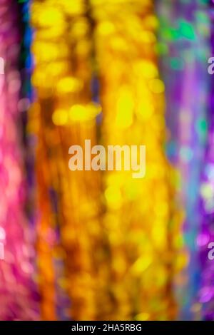 Background multicolored shiny tinsel Stock Photo - Alamy
