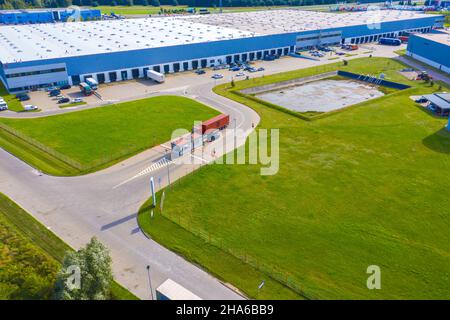 Aerial Shot of Industrial Loading Area where Many Trucks Are Unloading ...