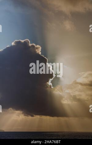 Crepuscular rays trying to break through the cloud cover Stock Photo ...