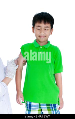 Doctor vaccinating boy's arm. Asian illness boy get an injection ...