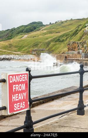 danger from heavy seas warning sign Stock Photo - Alamy