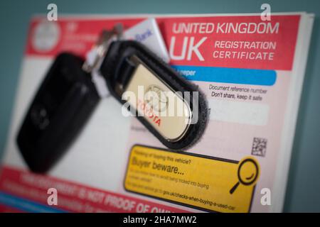 V5C Car registration certificate also known as vehicle log book, with car keys Stock Photo - Alamy