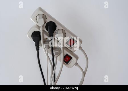 Wires plugged into power bar Stock Photo - Alamy