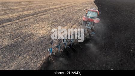 The tractor cultivates the soil. To retain moisture in early spring ...